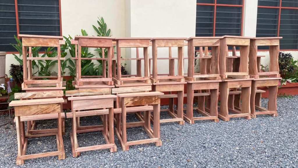 Justine Senuvie Memorial Foundation donates 100 desks, scholarships to ...